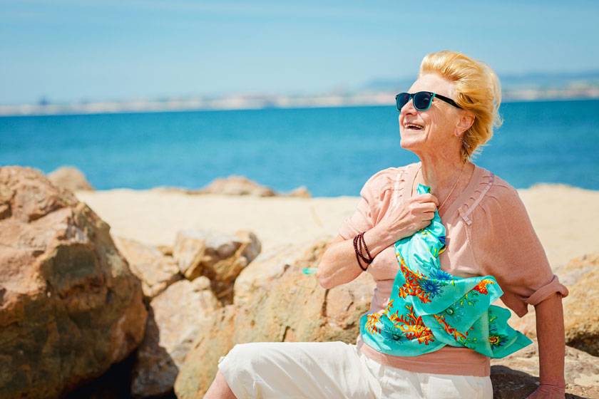 A Relaxing Day Out For Seniors On Oceanfront Boardwalk And Promenade In ...
